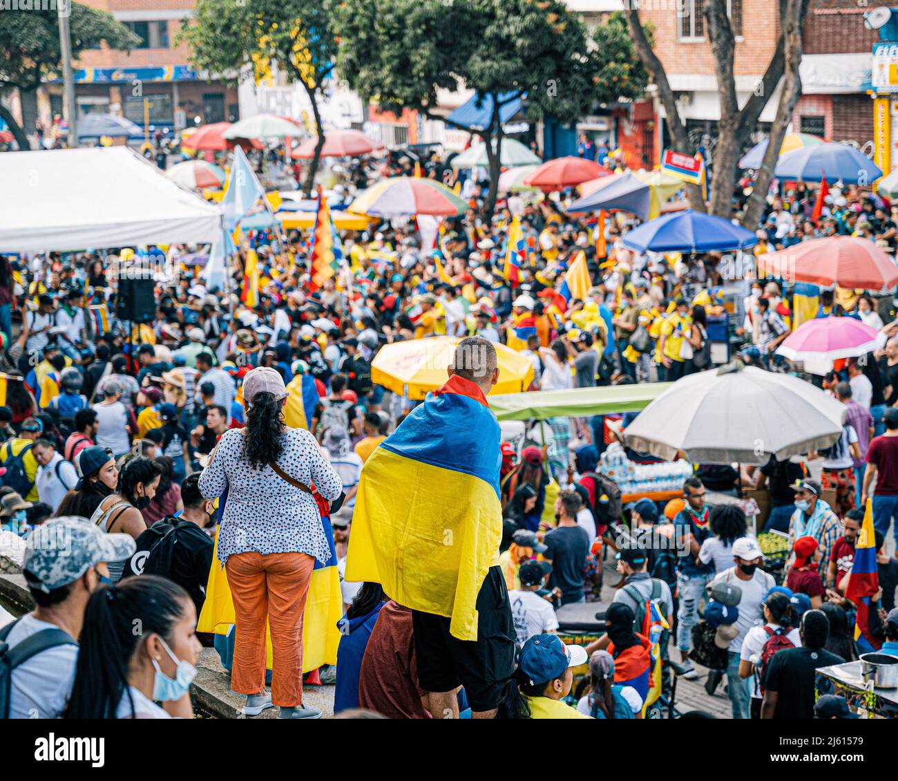 Man can been seen wrapped in Colombian flag among crowd in government ...