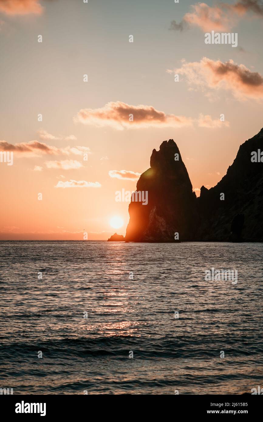 Dramatic Seascape over the beach during sunset, with rocky volcanic ...