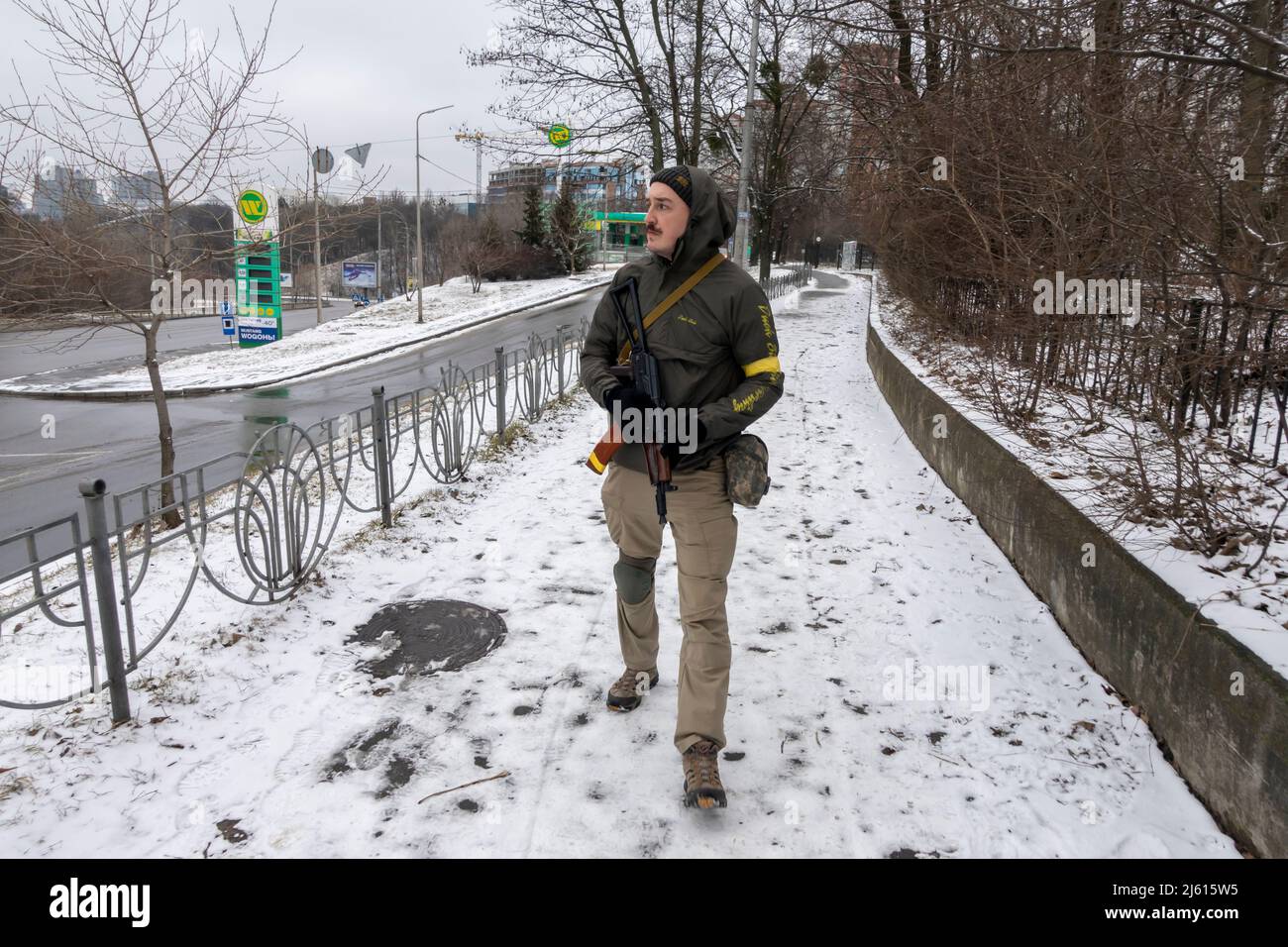 KYIV, UKRAINE 01 March. A member of Kyiv's civil defense walks with a ...