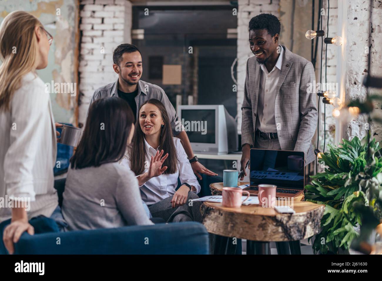Business colleagues having informal discussion hi-res stock photography ...