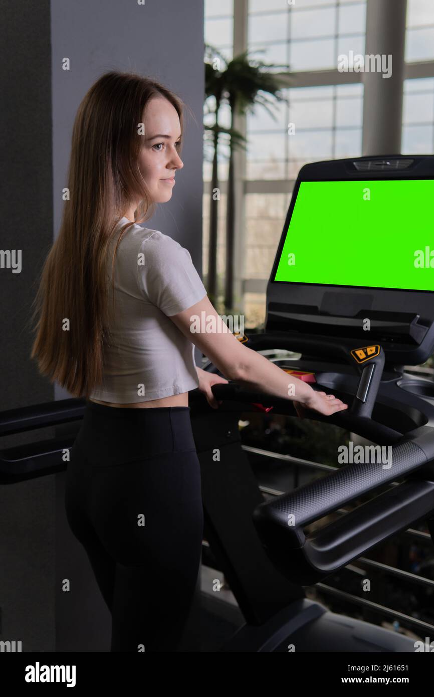 Woman indoors length young treadmill profile full exercise people ...