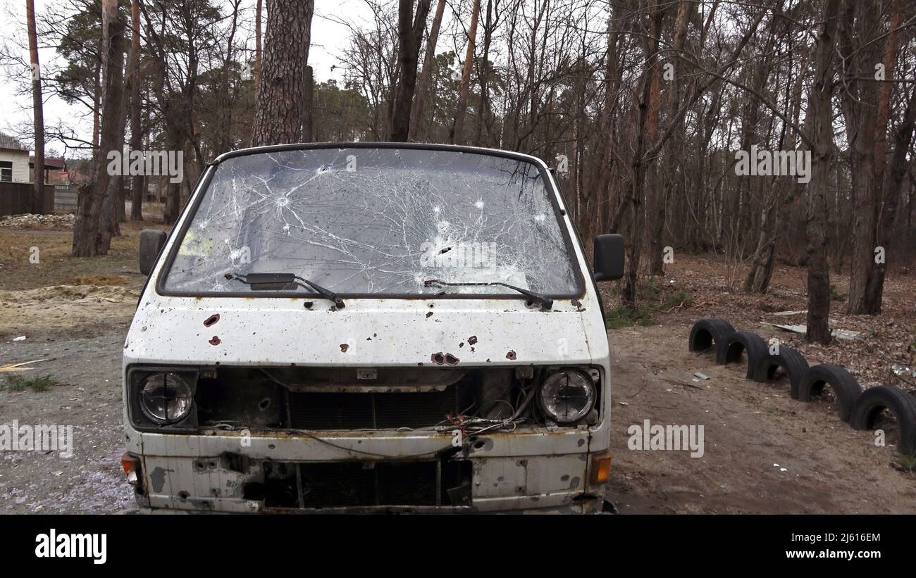 HORENKA, UKRAINE 06 March. A deserted vehicle riddled with machine gun ...