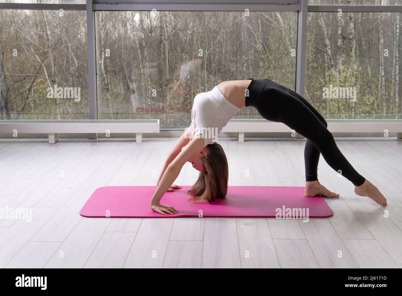 The the of mat bridge on Stands the in pose fitness red bridge, from ...