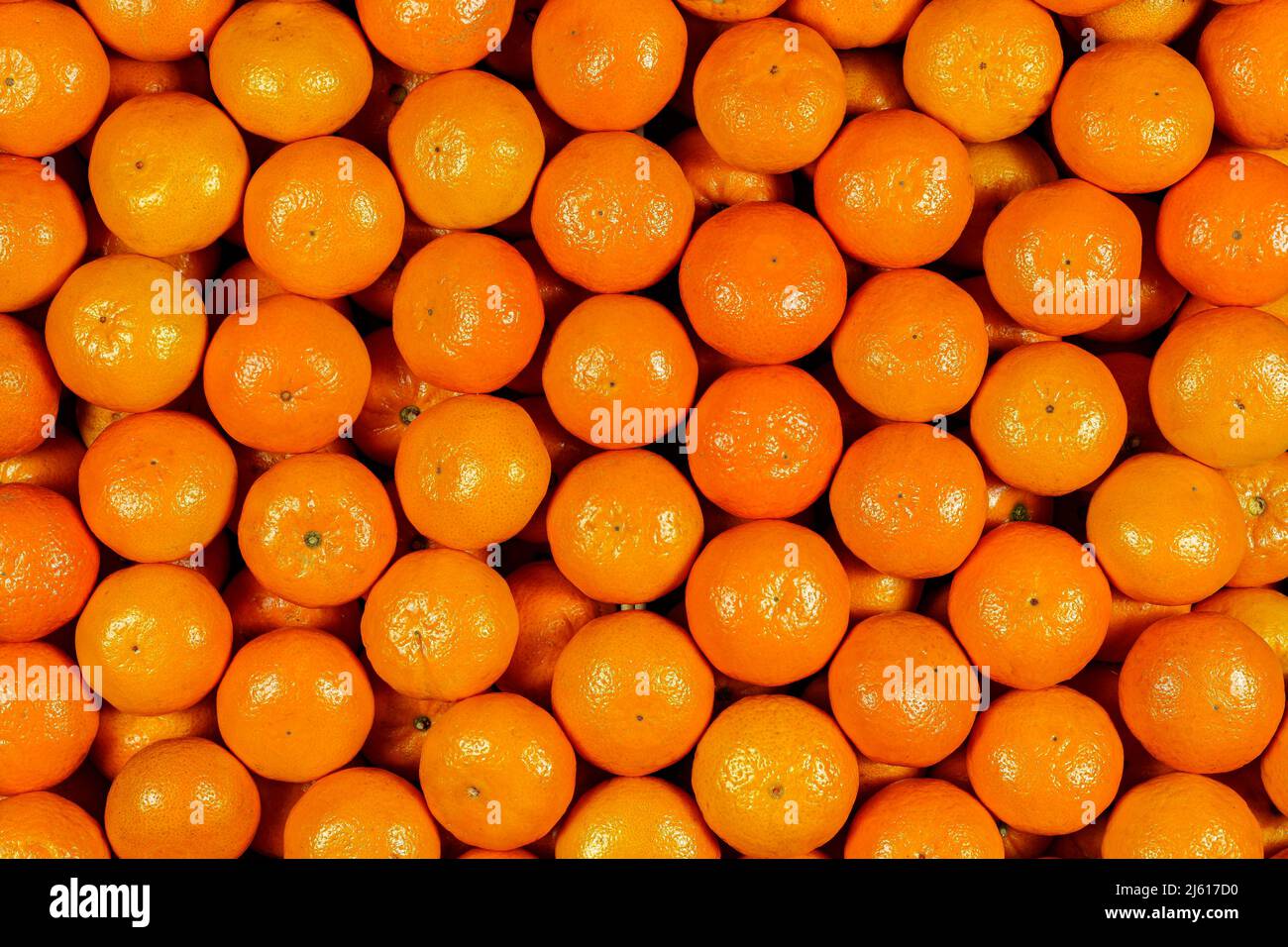 Background many orange tangerines hi-res stock photography and images ...
