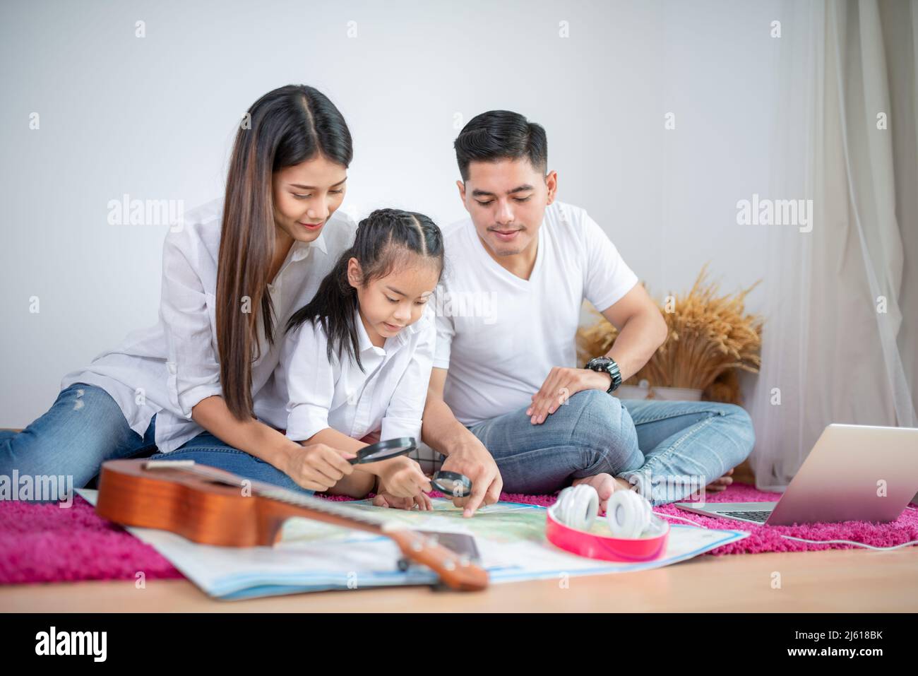 happy family mother, father, child daughter play laptop computer at ...