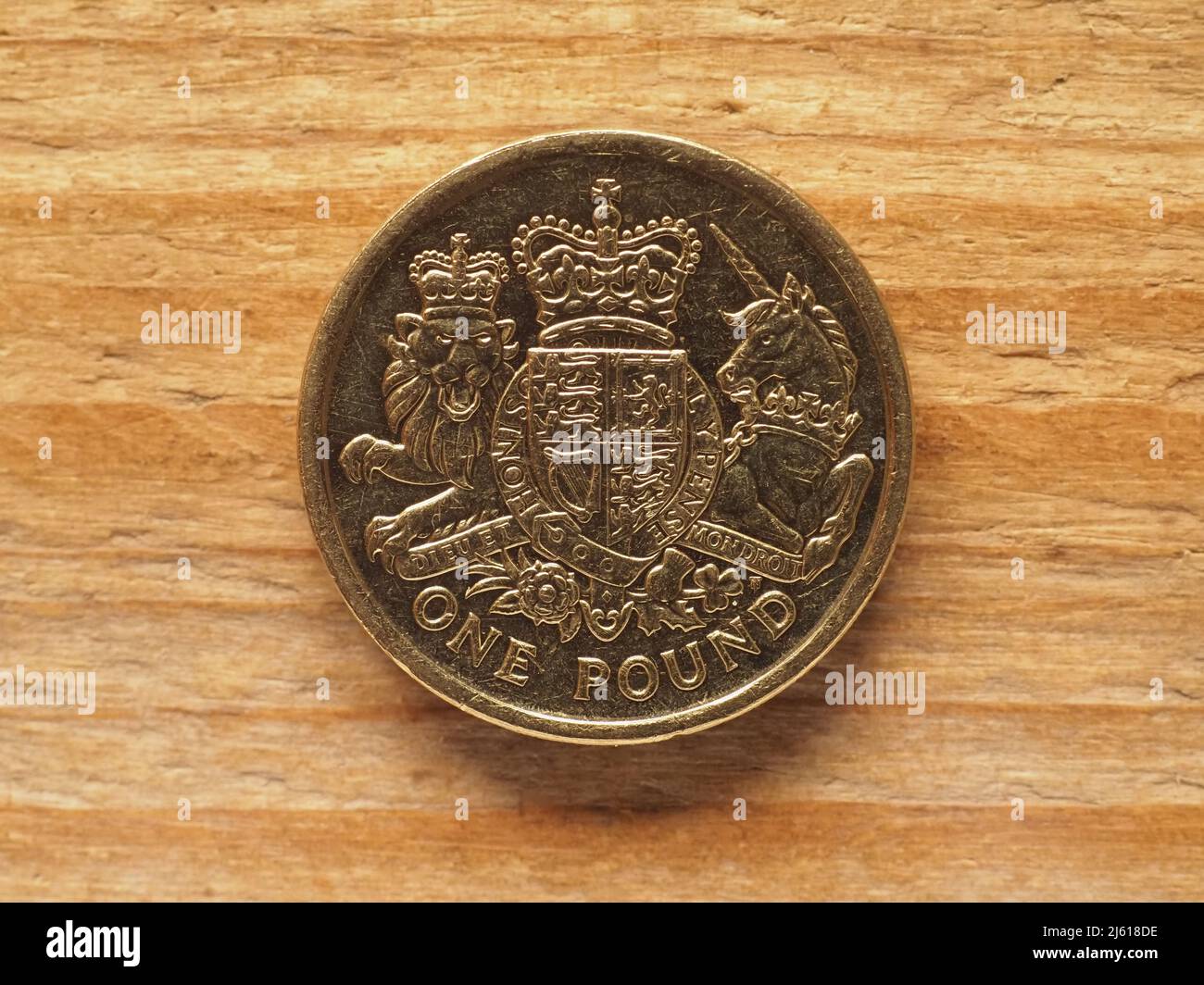 one pound coin reverse side showing the Royal Arms, currency of the ...