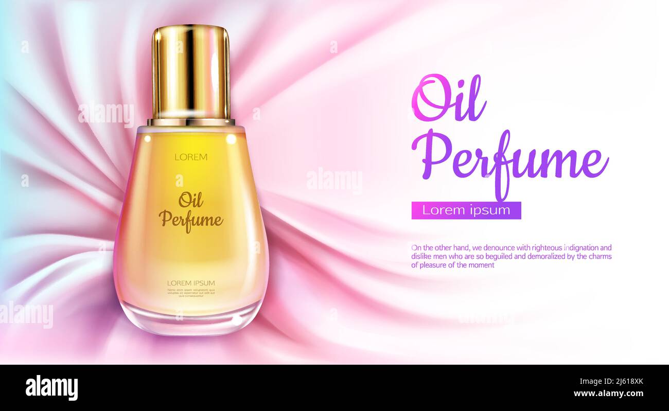 Oil perfume glass bottle with yellow liquid on pink silk draped fabric ...