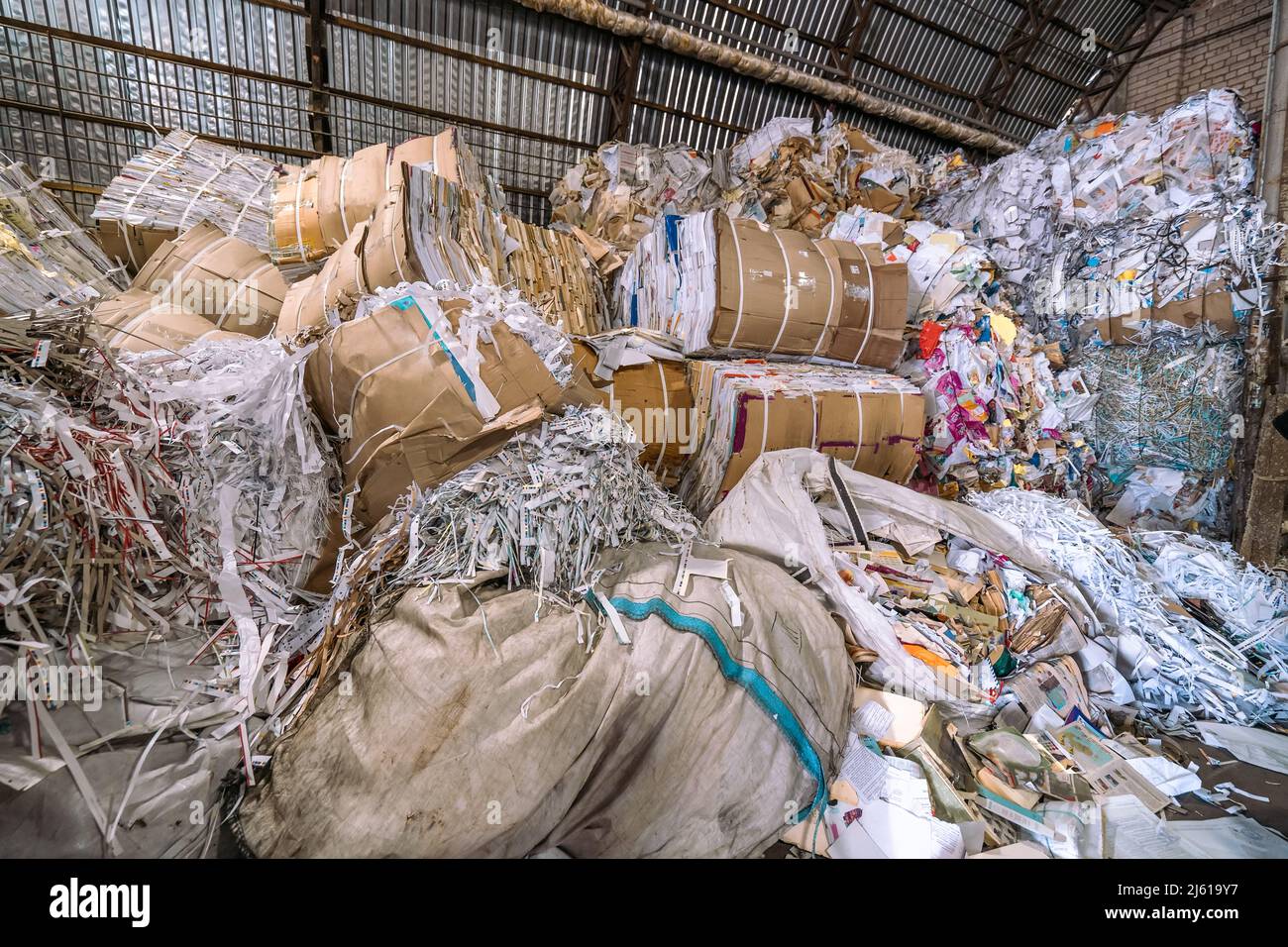 Waste paper sorting and filing for processing at paper recycling plant ...
