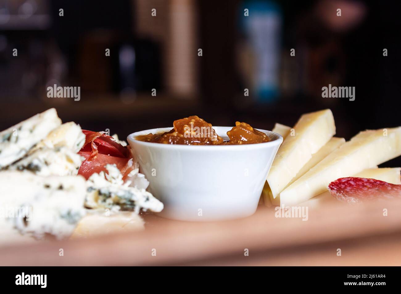 Cheese Plate. Sauce with different cheese's kinds Stock Photo - Alamy