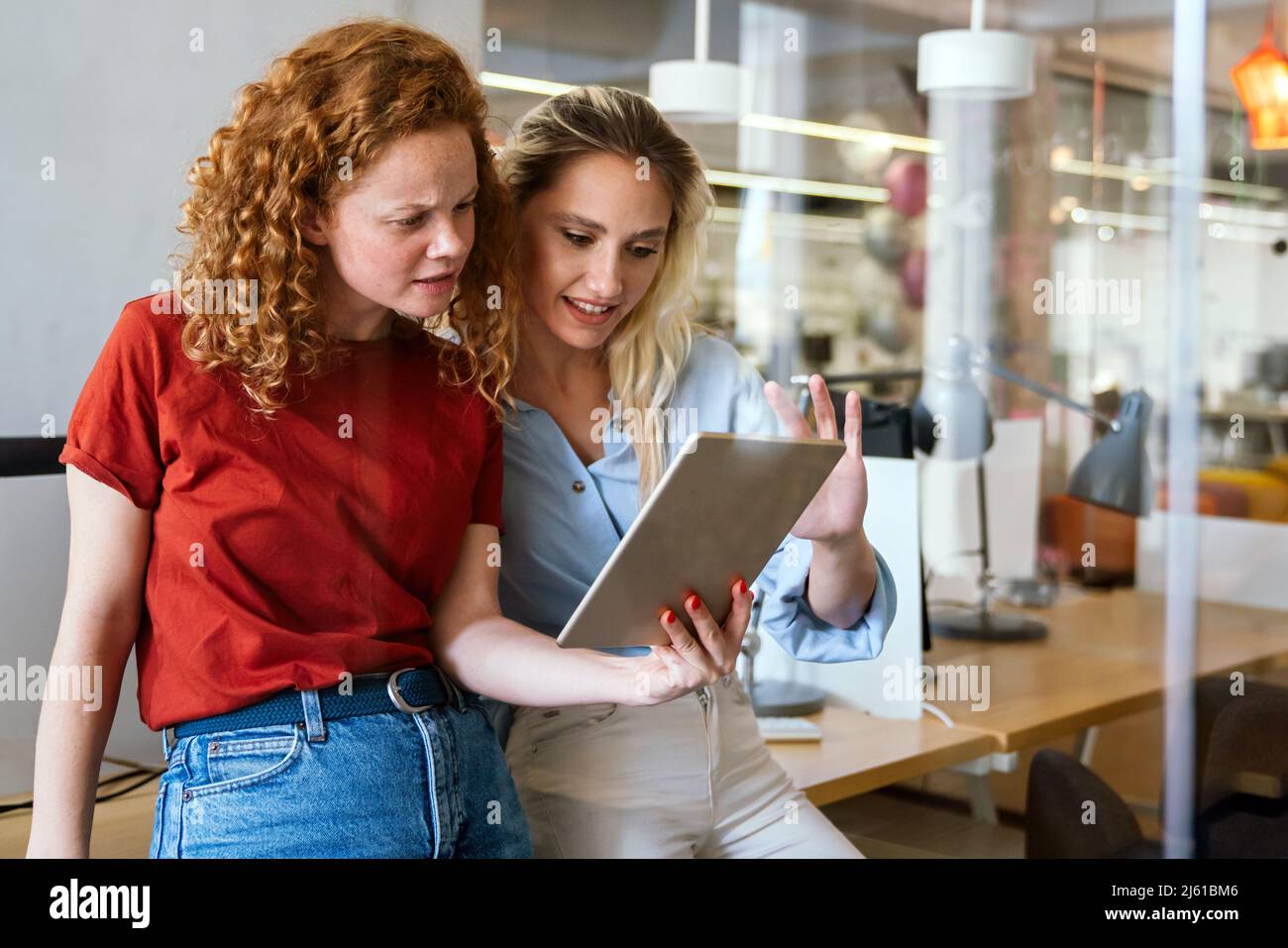 Portrait of happy young people working together and having fun in ...