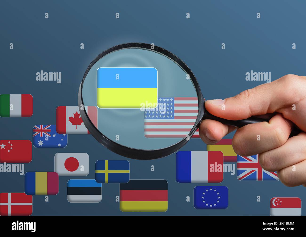 Hand pushing on a touch screen interface, choosing Ukraine. flags of ...