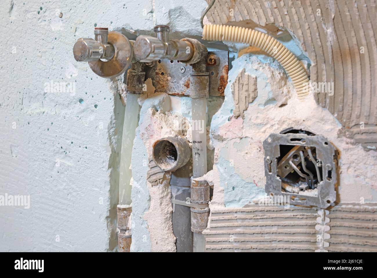 Drain pipe and water pipes in a plaster wall, under construction Stock ...