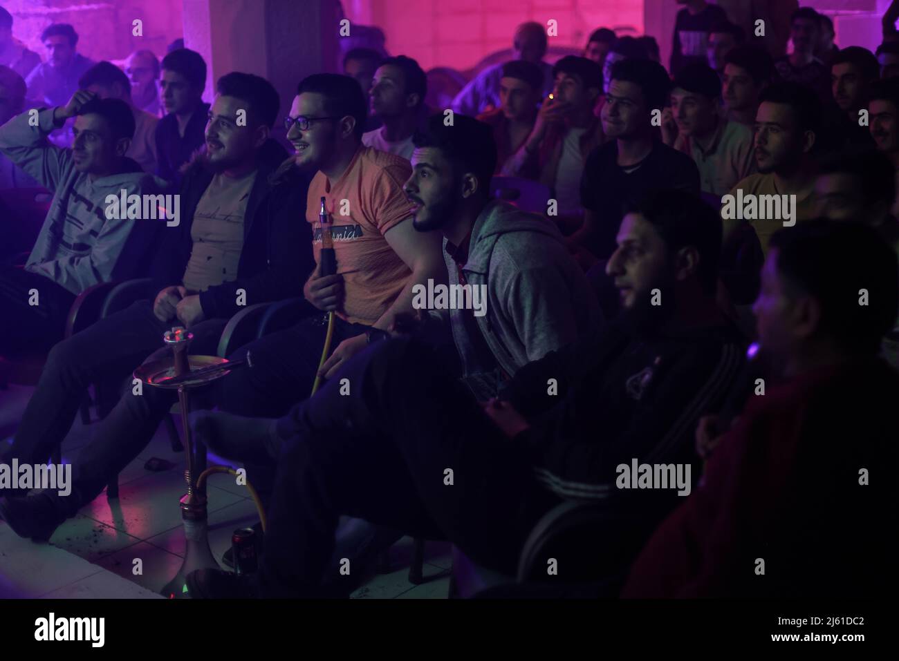 Ariha, Syria. 26th Apr, 2022. Young people watch a UEFA Europa League ...