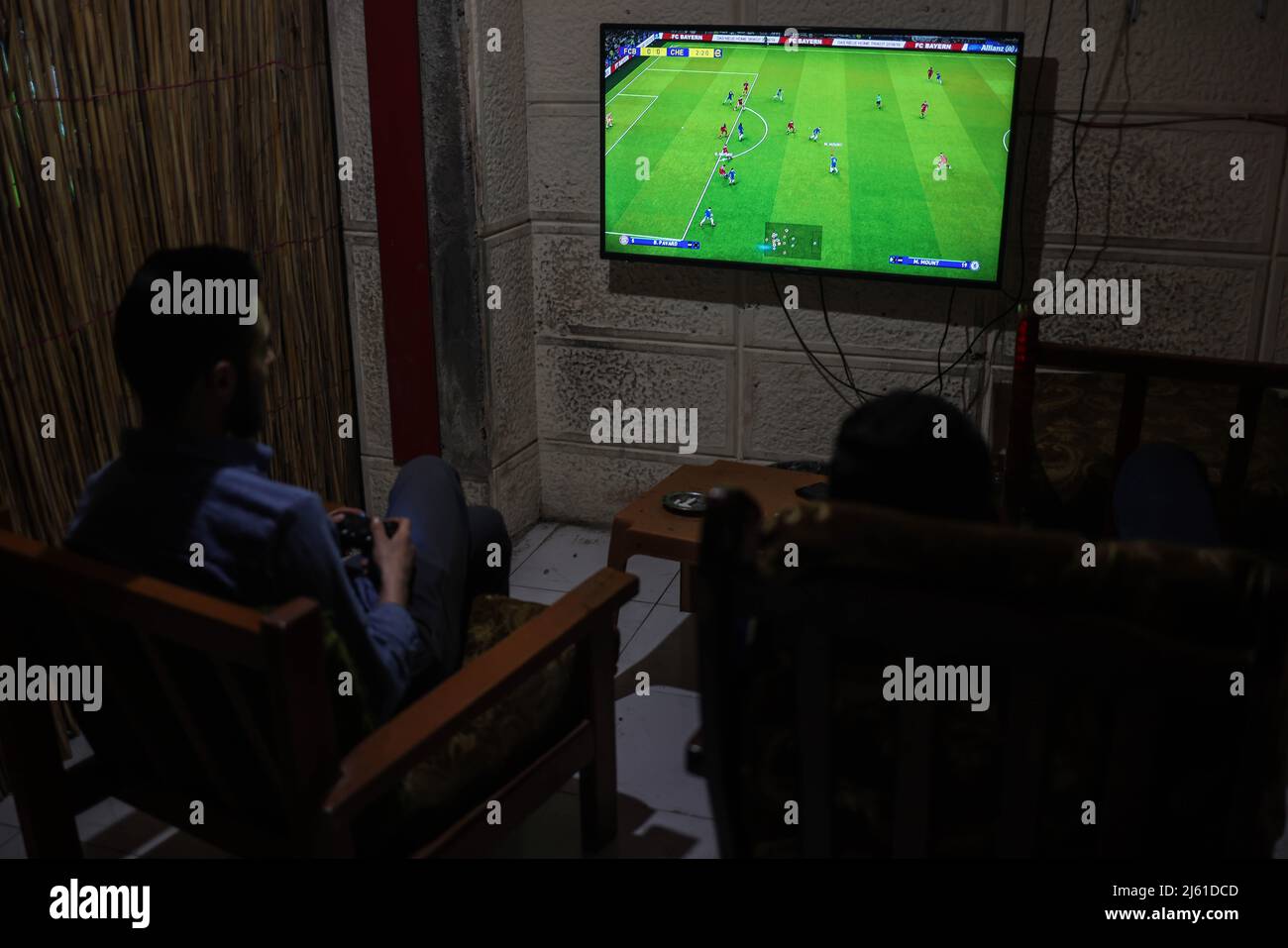Ariha, Syria. 26th Apr, 2022. Young people play video games in a games ...