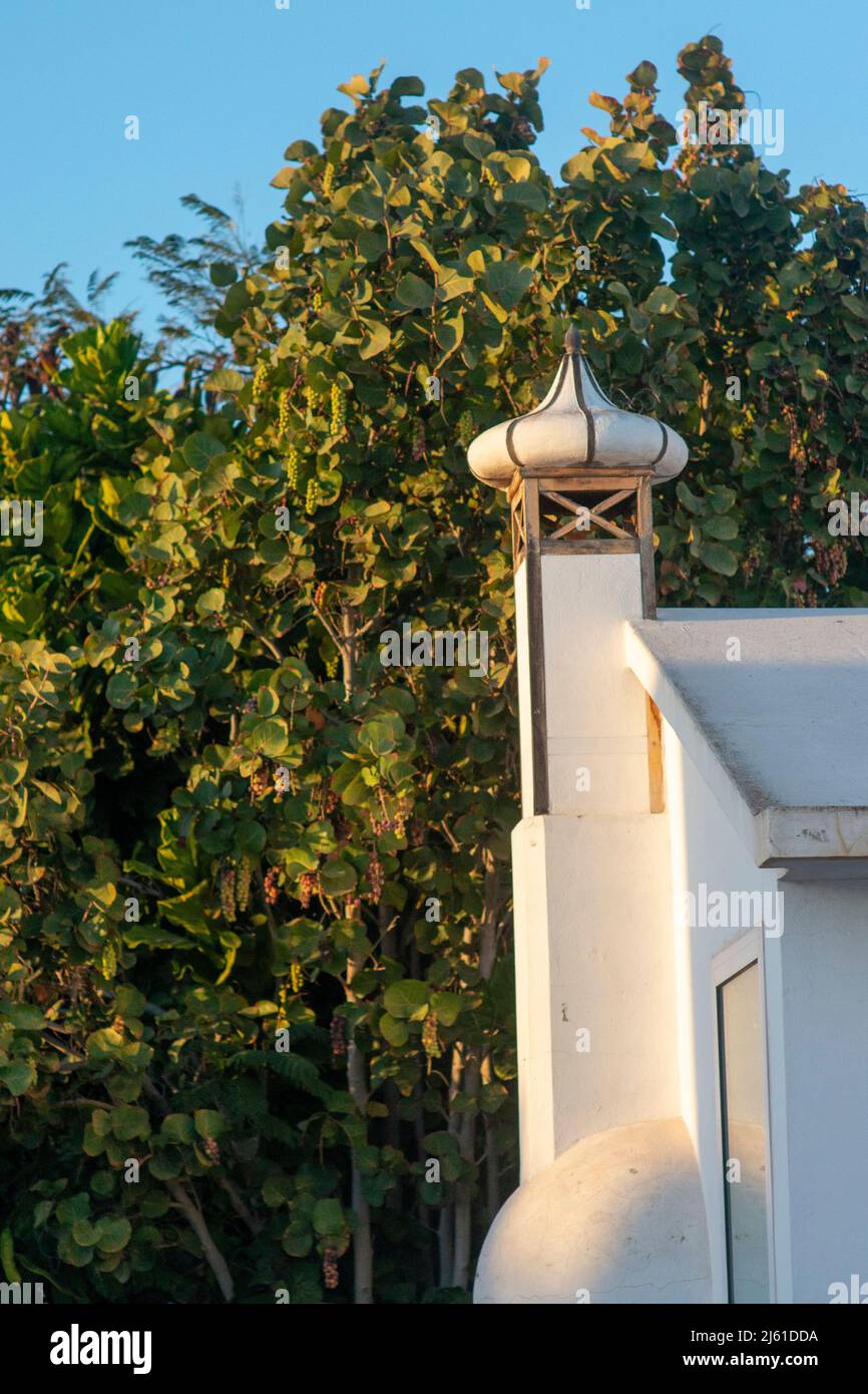 Beautiful chimneys are typical for traditional houses of Lanzarote, one ...