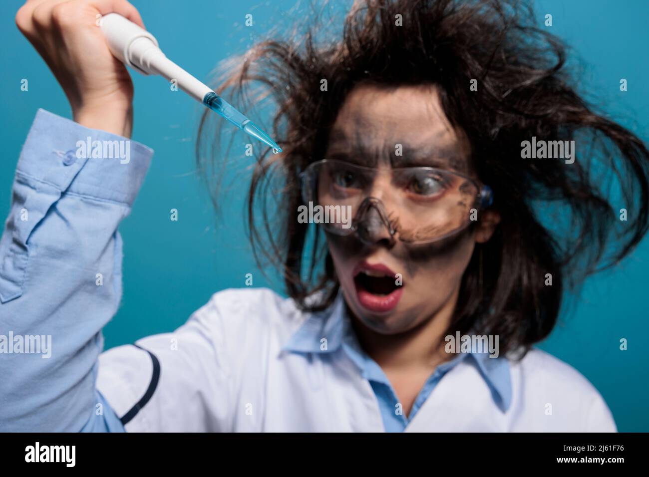 Crazy mad chemistry reasearcher with dirty face and messy hair ...