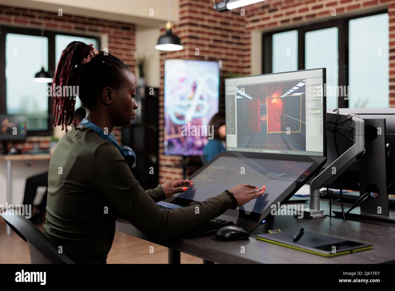 Electronic arts company employee working on 3D project while modeling ...