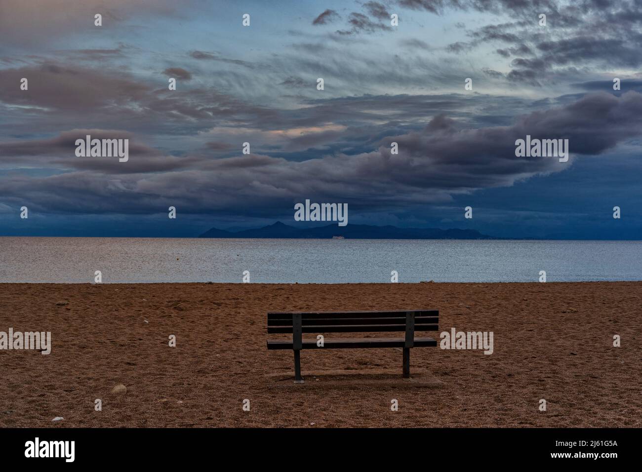 Lonely bench on Glyfada's beach, Athens. Greece Stock Photo - Alamy