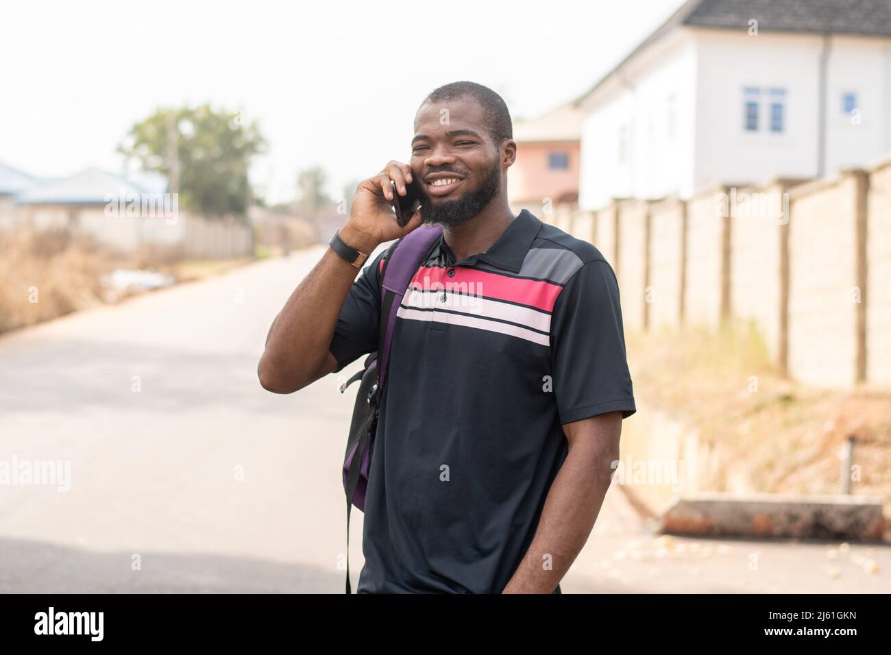 african man making a phone call Stock Photo - Alamy