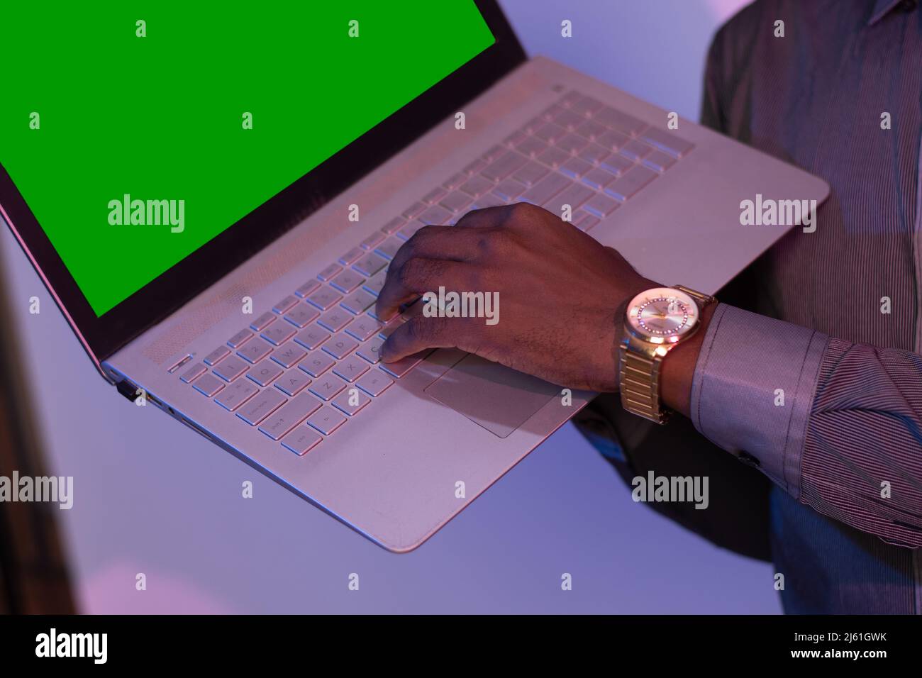 black man using a laptop with green screen Stock Photo - Alamy