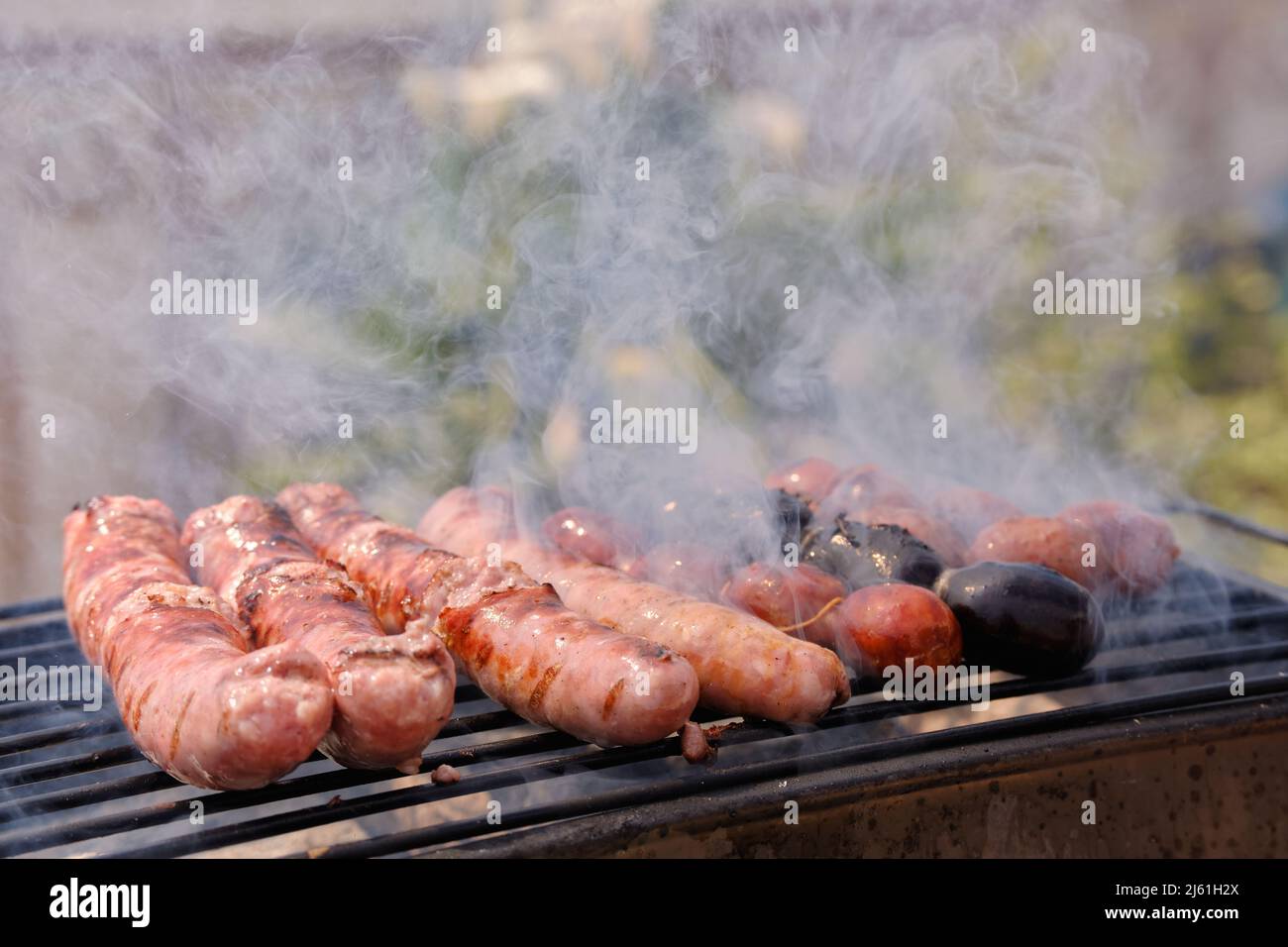 Barbecue grill for an outdoor summer party. Barbecue smoke. Background ...