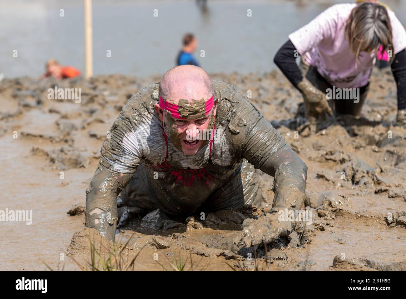 Man crawling in the mud at the Maldon Mud Race 2022 on the River ...