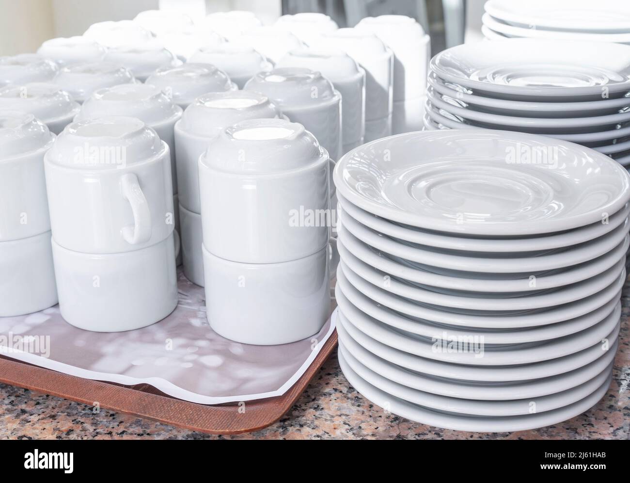 Set of white dishes and cups on the table in a buffet restaurant Stock ...