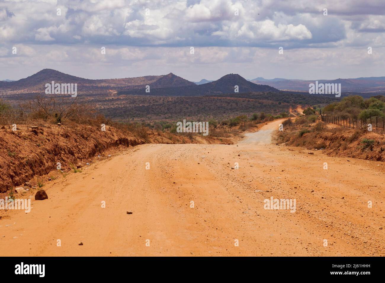 An empty dirt road in the arid landscapes of Nanyuki, Kenya Stock Photo ...