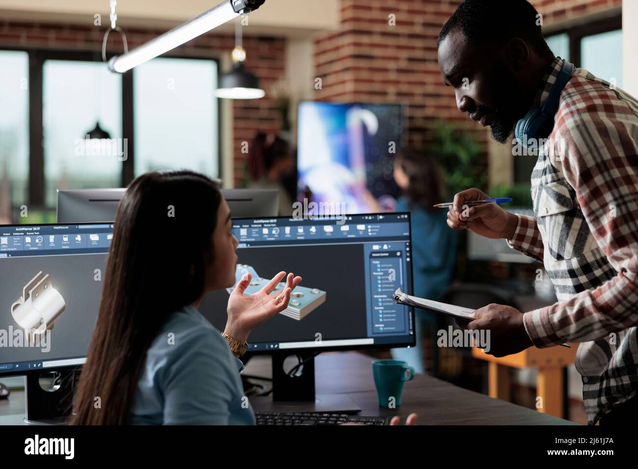 Production department employees developing advanced graphics technology ...