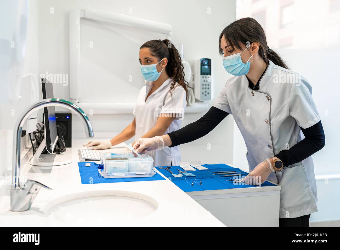 Nurses preparing surgical instruments in operating room at hospital ...