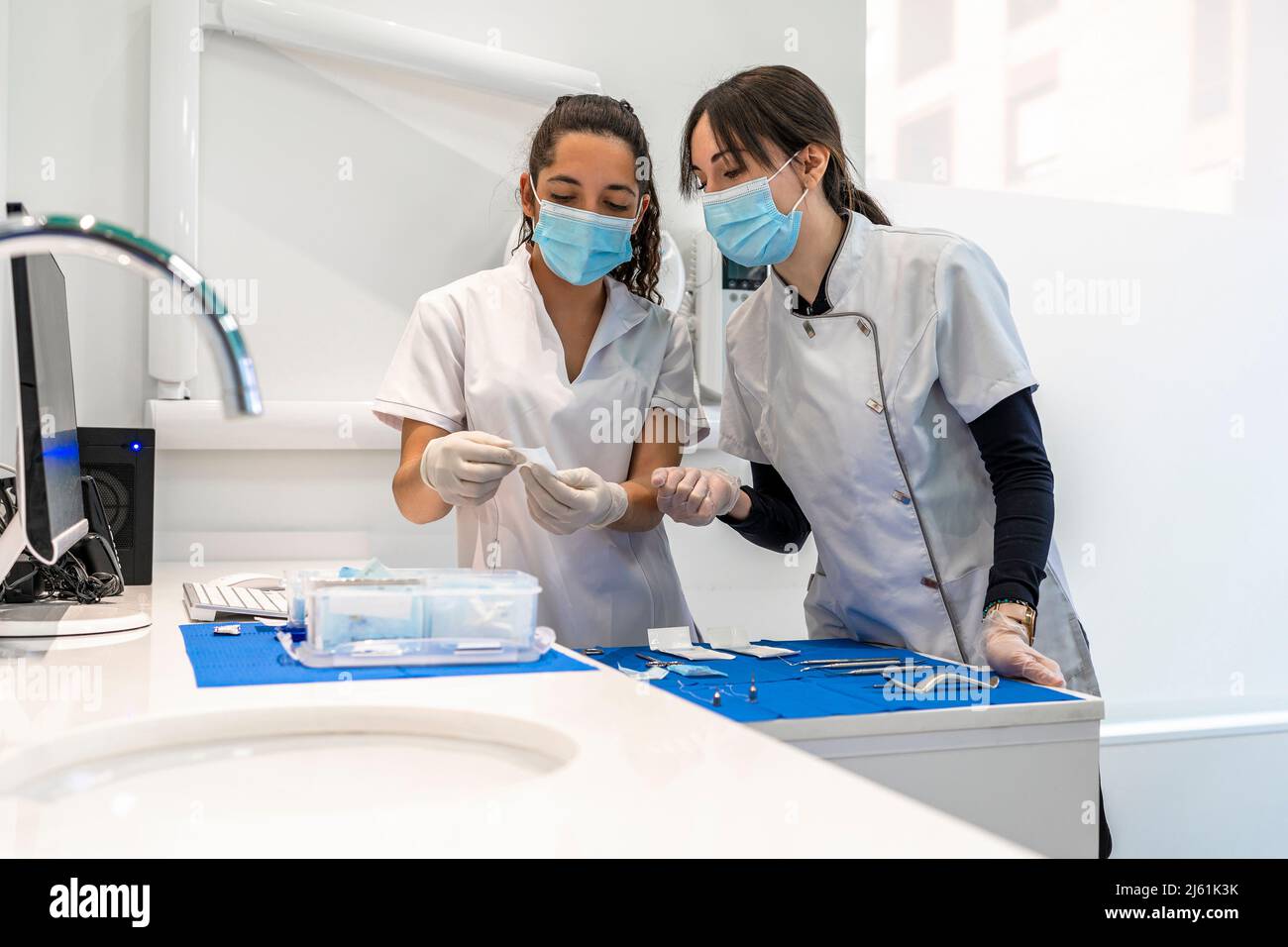 Nurses checking surgical instruments in operating room at hospital ...