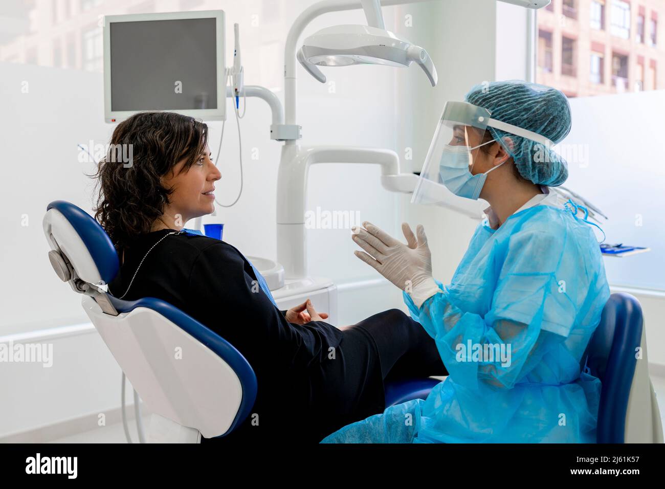 Doctor with patient discussing in operating room at maxillofacial ...