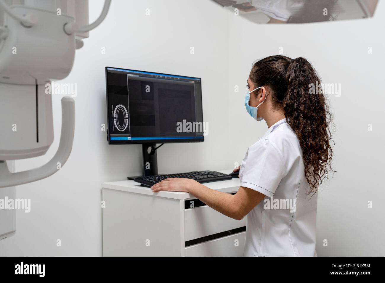 Nurse working on computer in maxillofacial clinic Stock Photo - Alamy