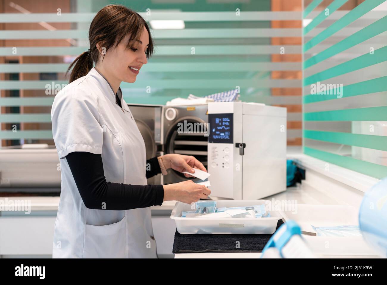 Nurse preparing surgical instruments in operating room at hospital ...