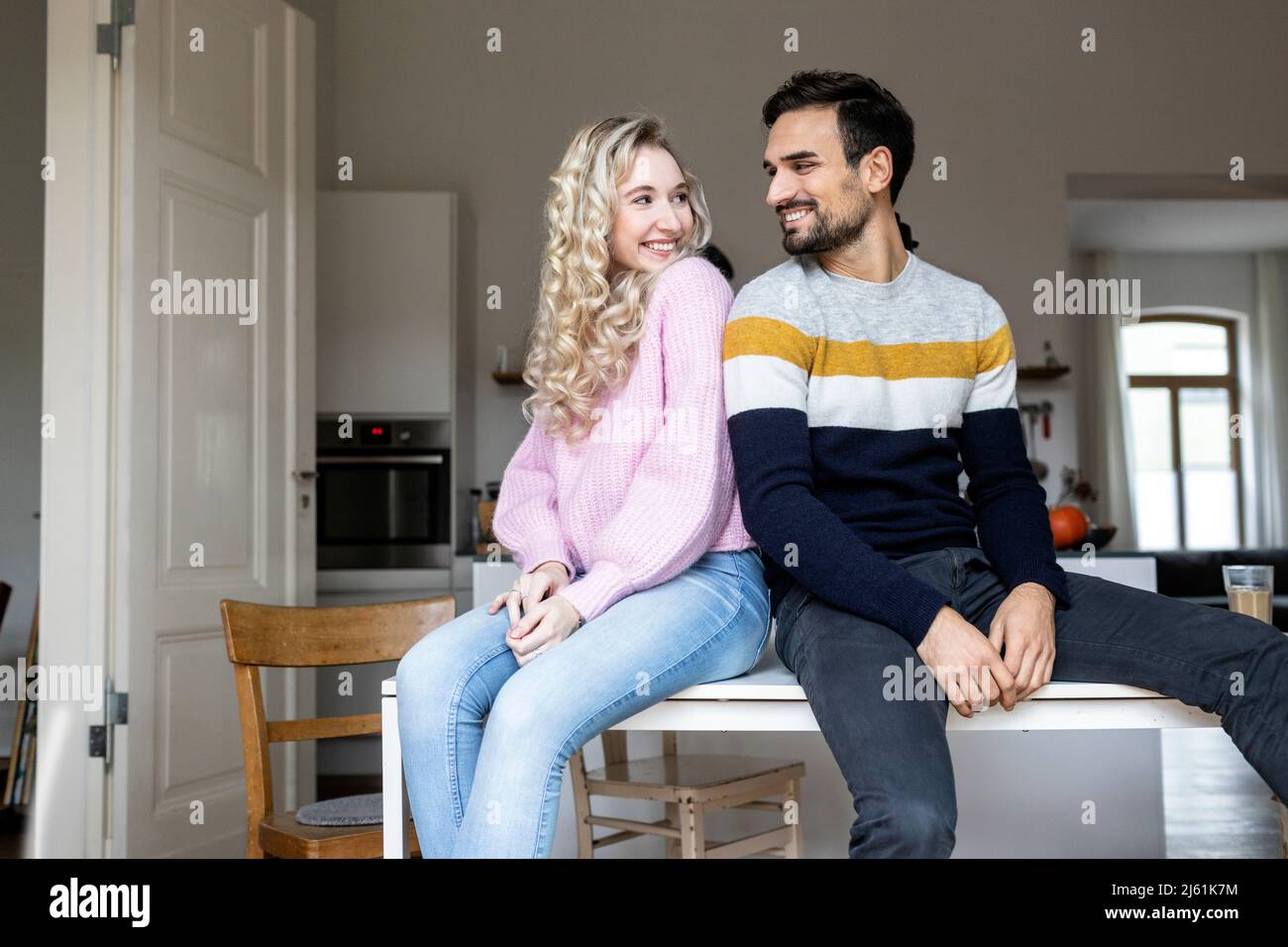 Boyfriend girlfriend sitting hi-res stock photography and images - Alamy