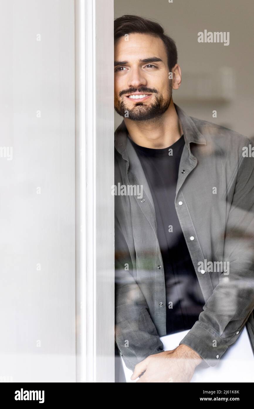 Man through glass hi-res stock photography and images - Alamy