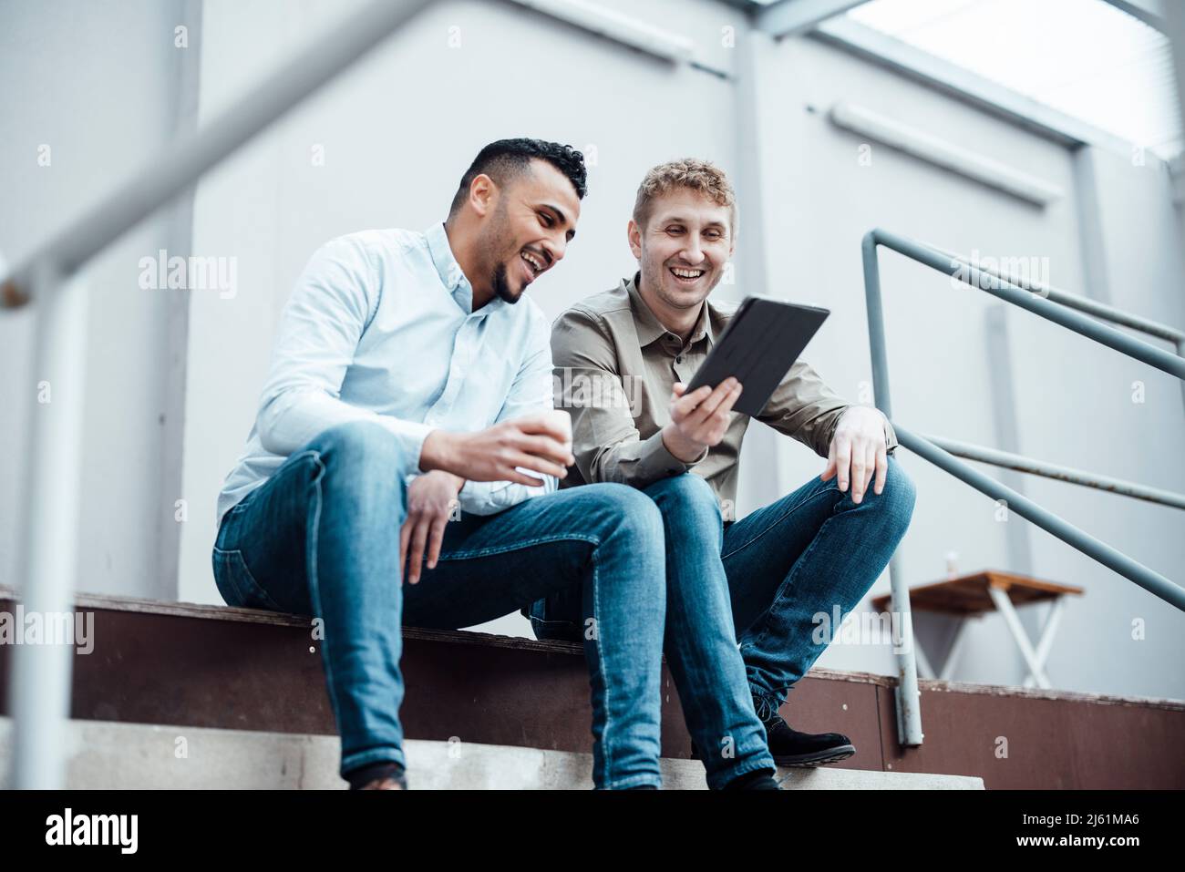 Businessman laughing office railing hi-res stock photography and images ...