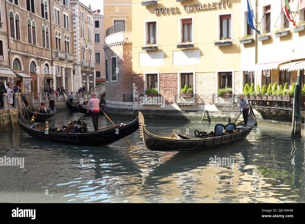 The famous Venetian gondoliers on their gondolas in Venice Italy Stock ...