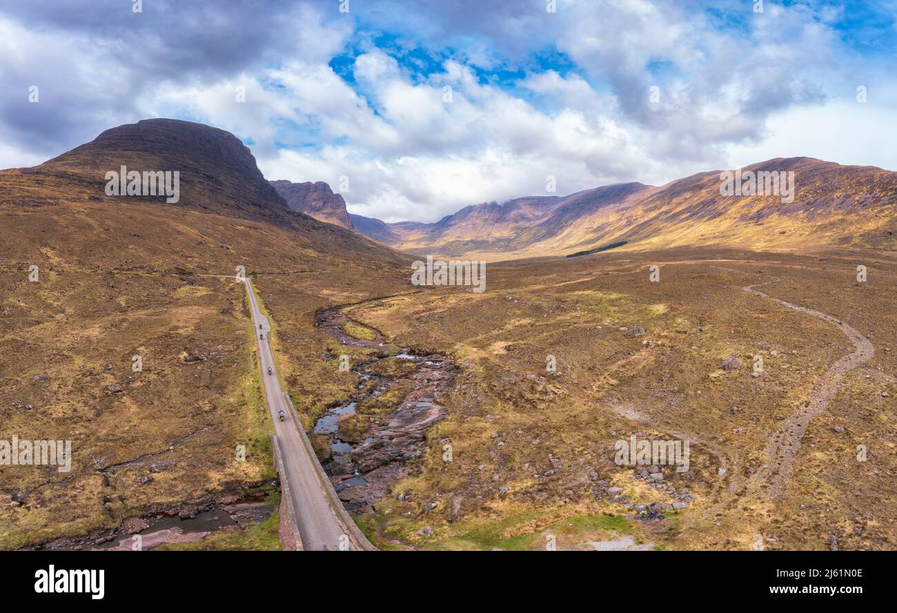 Applecross pass road passing over Russel Burn stream with mountains in ...