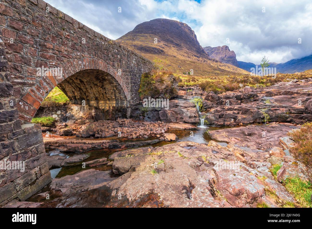 Stone bridge over Russel Burn stream by mountains Stock Photo - Alamy
