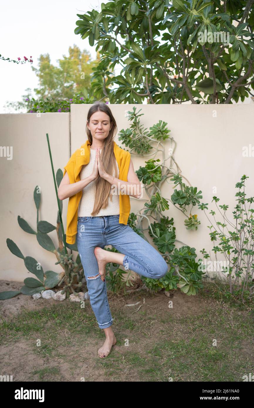 Woman yoga tree pose hi-res stock photography and images - Alamy