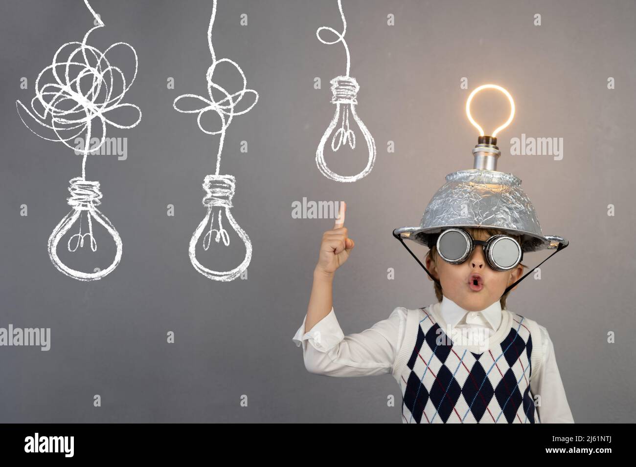 Smart child pretend to be businessman. Funny kid wearing helmet with ...