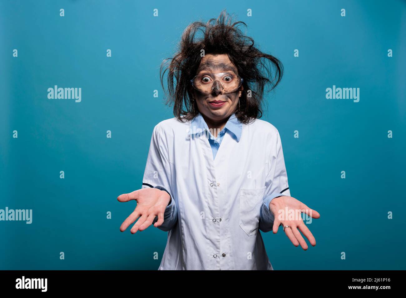 Foolish laughable crazy chemist with messy hair and dirty face does not ...