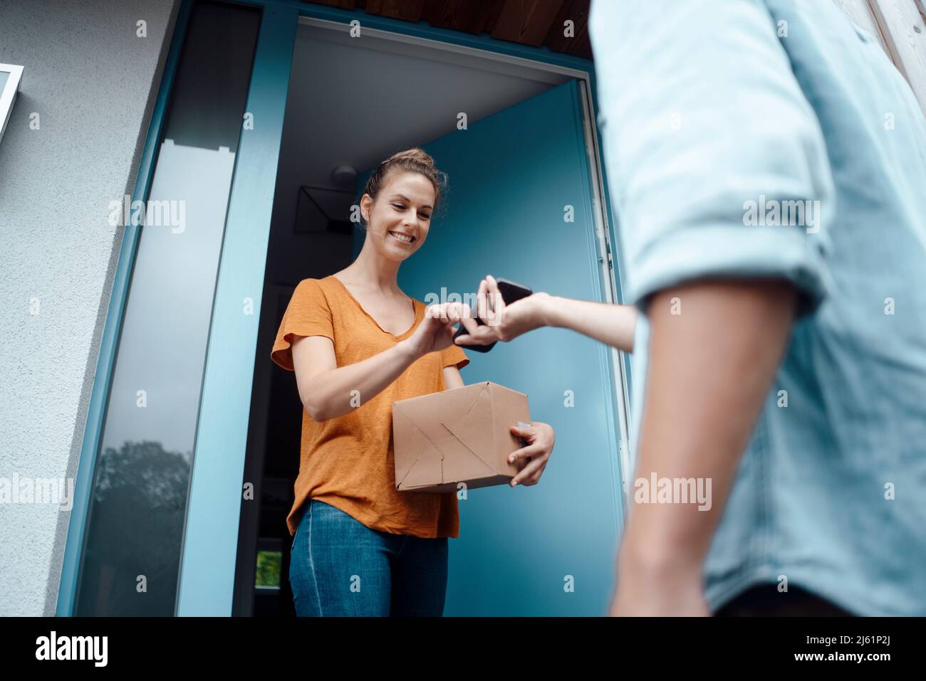 Signing for package hi-res stock photography and images - Alamy