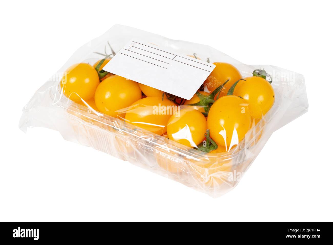 Packed and labeled yellow cherry tomatoes on an isolated white ...