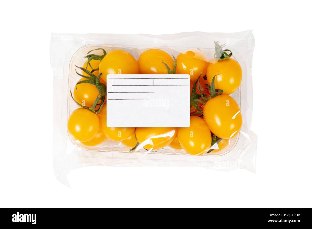 Packed and labeled yellow cherry tomatoes on an isolated white ...
