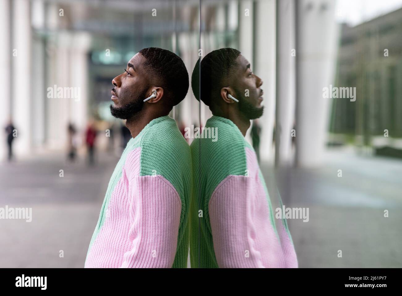 Glass to ear hi-res stock photography and images - Alamy