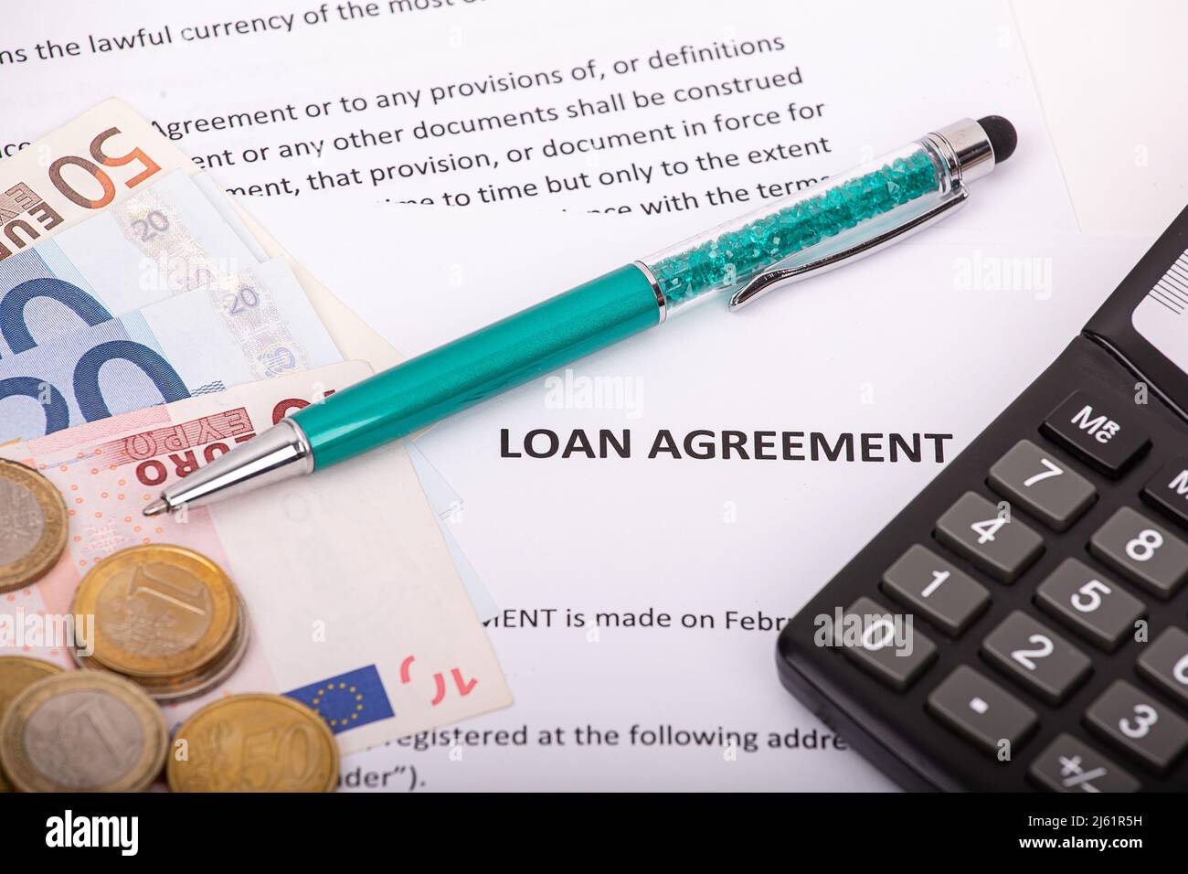 Mortgage. Euro, pen and calculator are on the loan agreement Stock ...