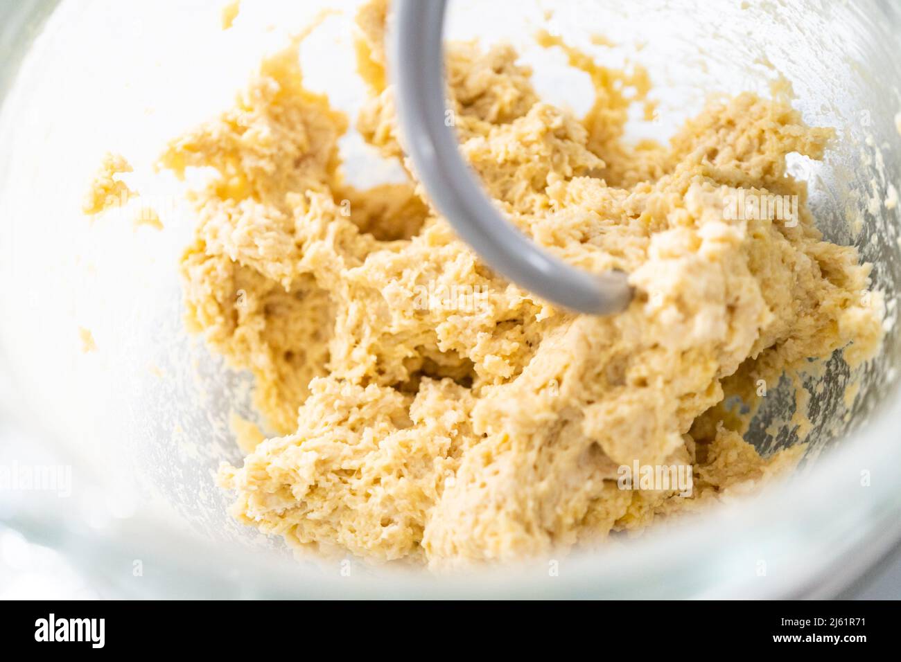 Mixing ingredients in kitchen mixer to bake homemade brioche buns Stock ...