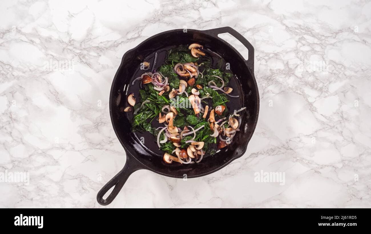 Flat lay. Step by step. Filling in cast iron skillet with vegetables to ...